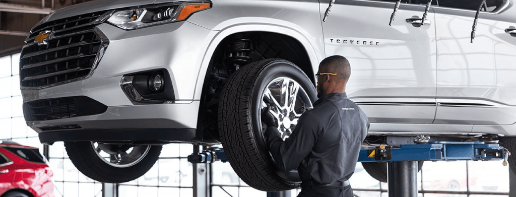 Service technician working on a Traverse - Davis Chevrolet Buick GMC ...